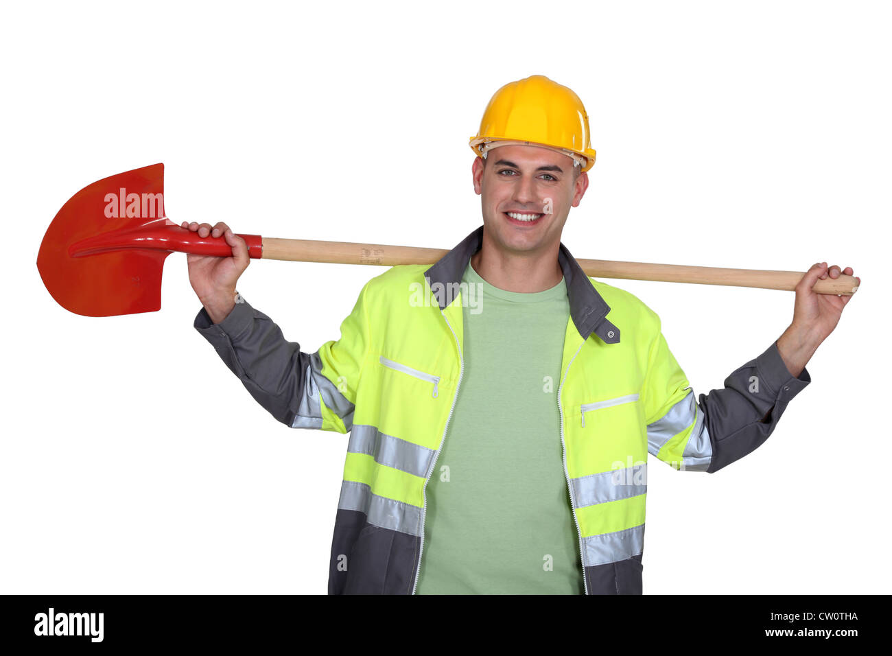 A construction worker with a shovel Stock Photo - Alamy