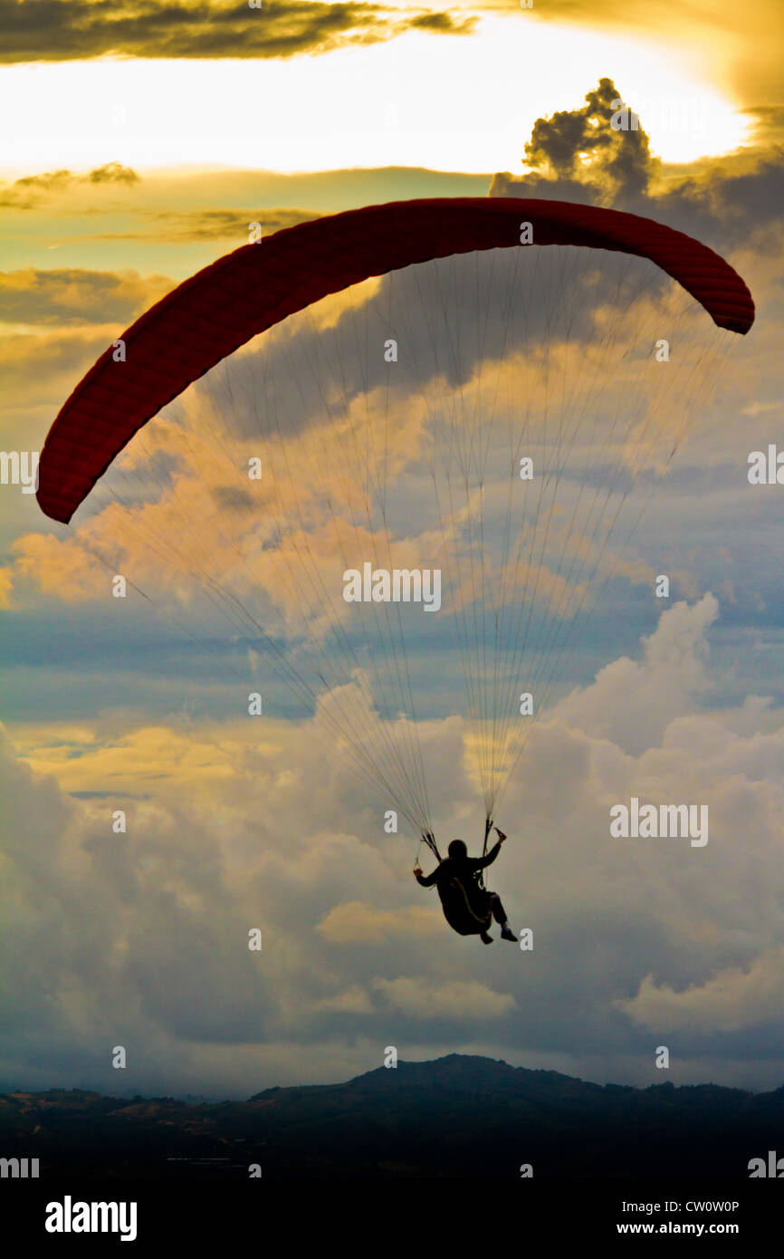 Red paraglider launches over Buccaramanga Stock Photo - Alamy