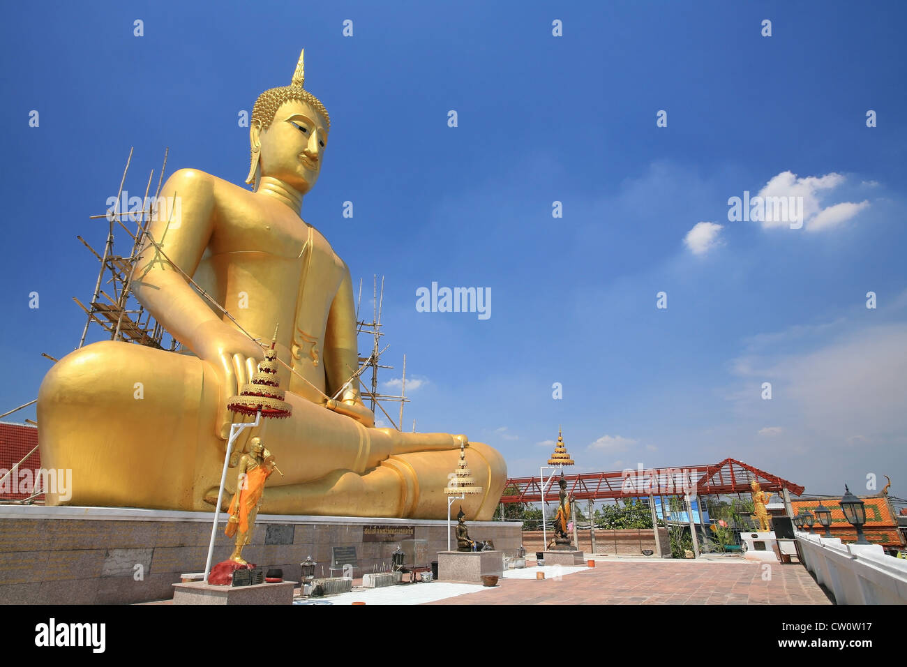 Huge gold cross-legged sitting Buddha statue with wooden scaffold ...