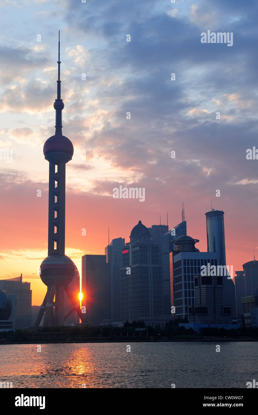 Shanghai morning city skyline silhouette over river with sunrise and ...
