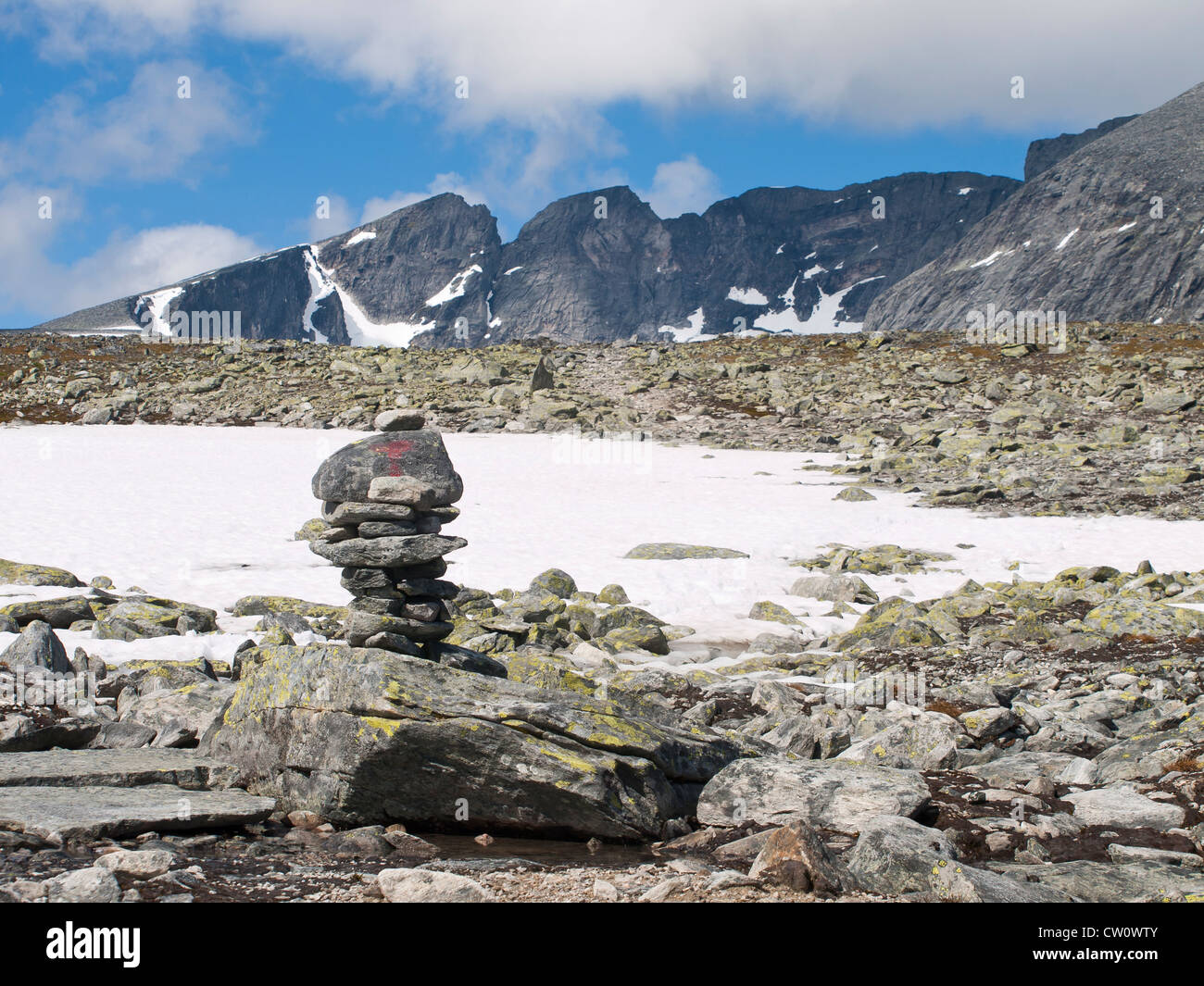Cairn showing the way to Snoehetta a mountain in the Dovrefjell ...