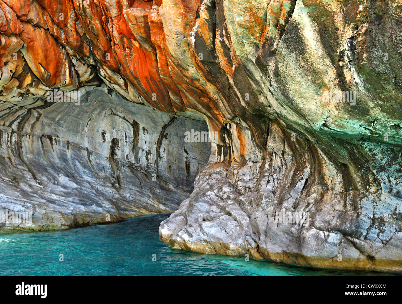 Entrance of a sea cave and colorful rocks at Marmara (or "Dialeskari ...