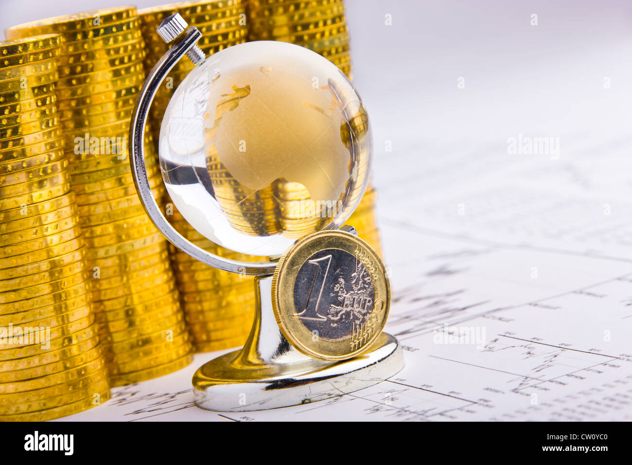 Euro money coin on world business stock charts Stock Photo - Alamy