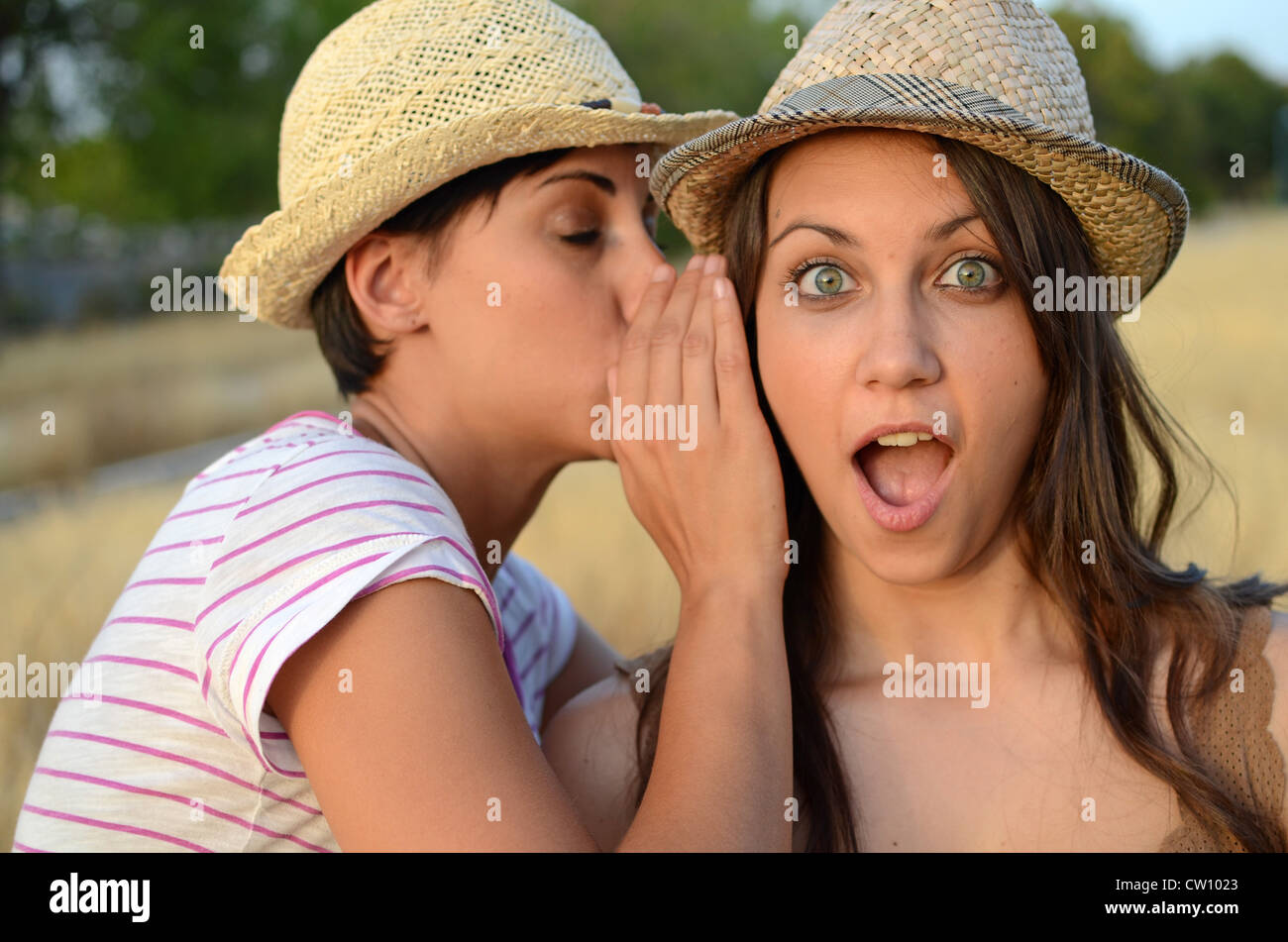 He whispers in her ear hi-res stock photography and images - Alamy