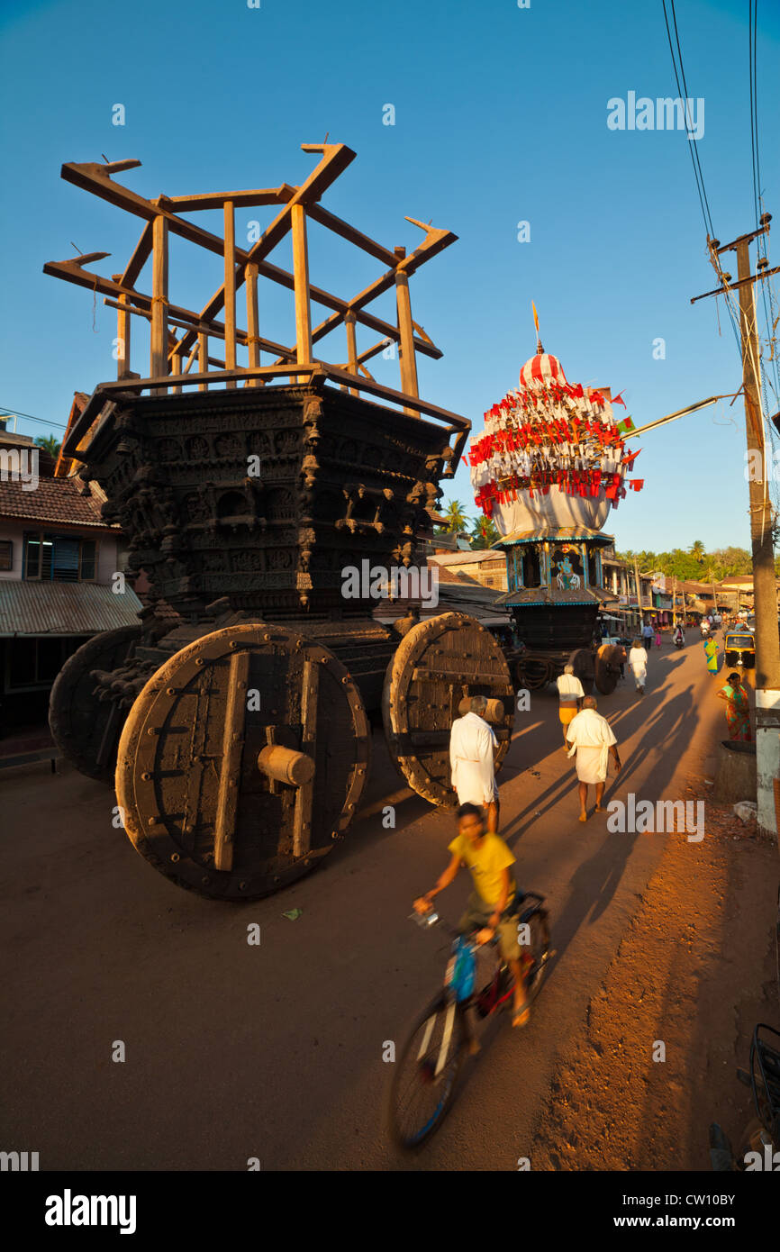 People walking past the giant temple chariots in Gokarna Stock Photo ...
