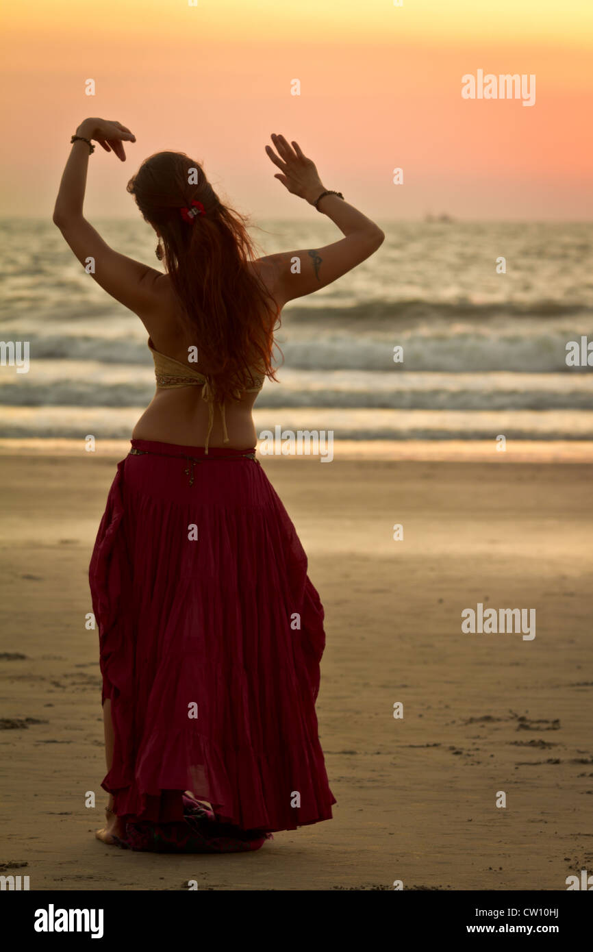Dancing at sunset on Arambol Beach, Goa Stock Photo - Alamy