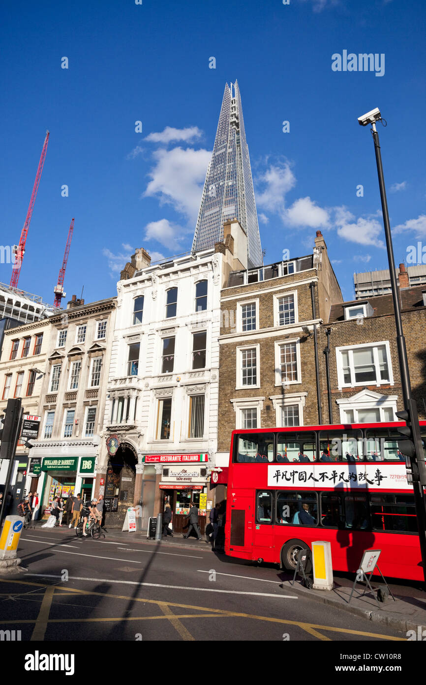 Street scene on Southwark Street with The Shard building in the ...