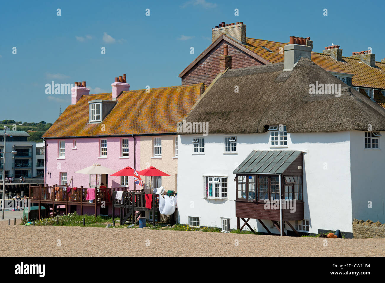 Beachfront cottages, West Bay, Dorset, England, United Kingdom Stock ...