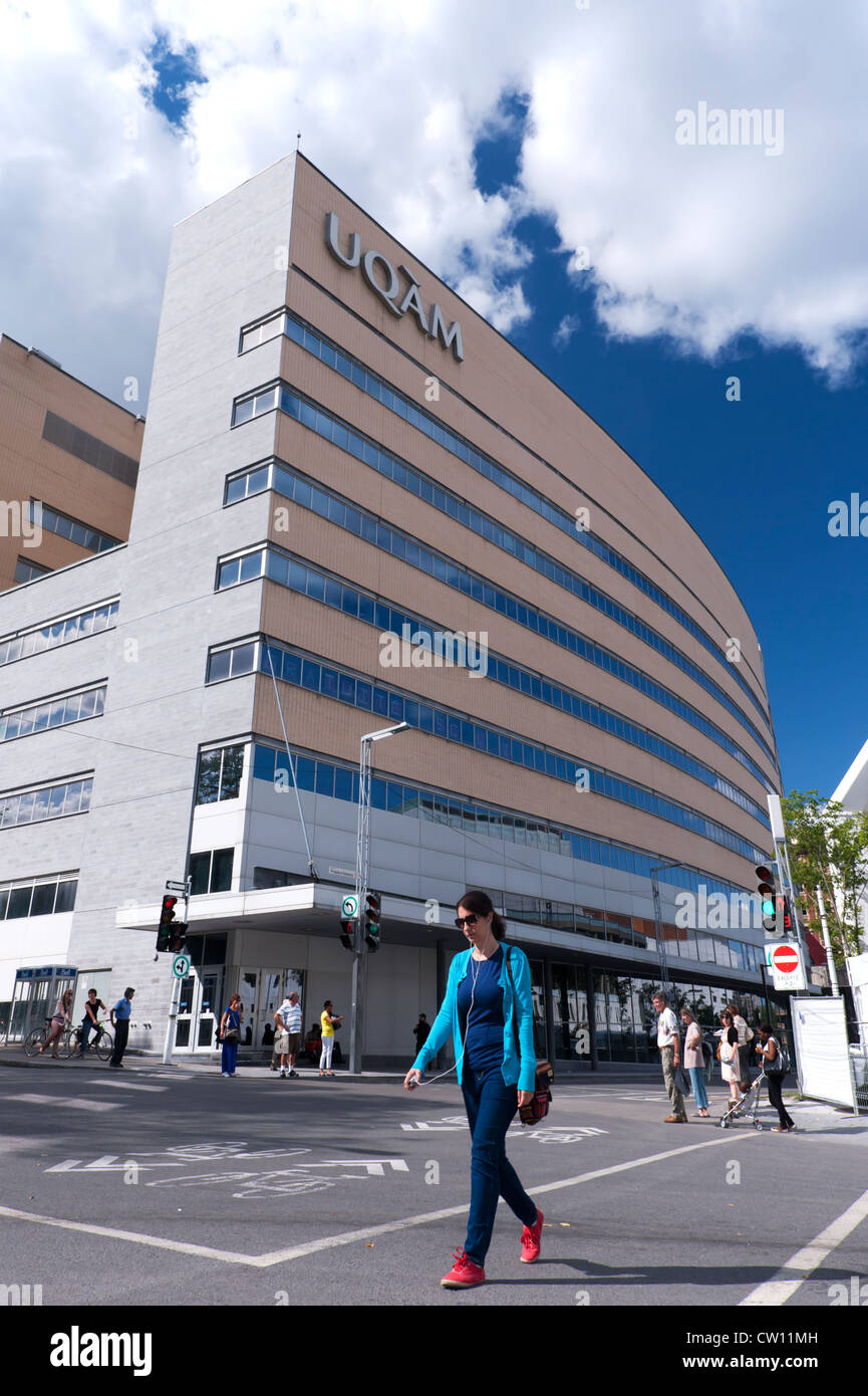 Woman crossing the street in front of the Président-Kennedy pavilion of ...