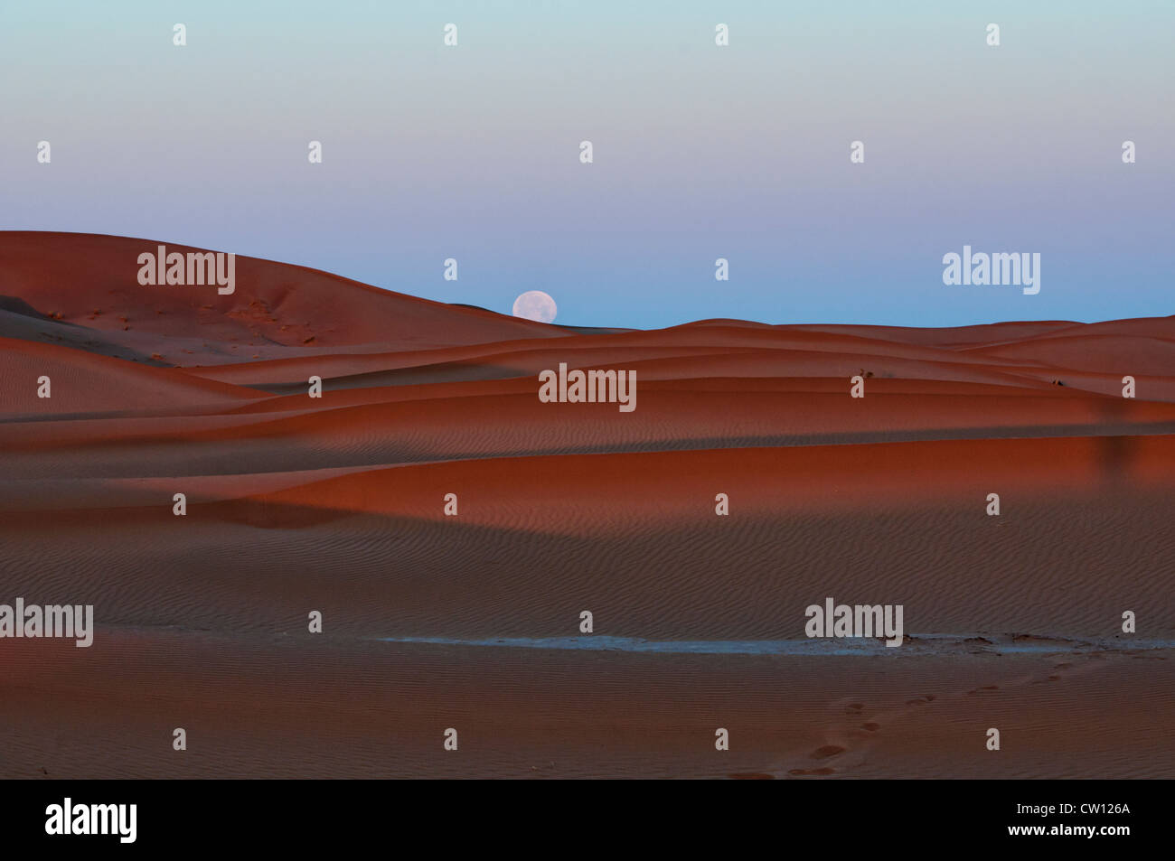 full moon over the Sahara Desert at Erg Chigaga, Morocco Stock Photo ...