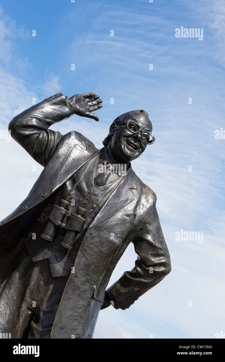 Bronze statue of comedian Eric Morecambe on the promenade in his home ...