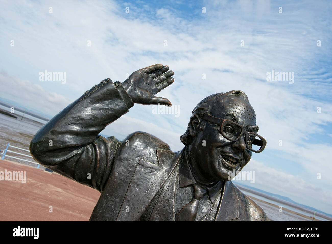 Bronze statue of comedian Eric Morecambe on the promenade in his home ...
