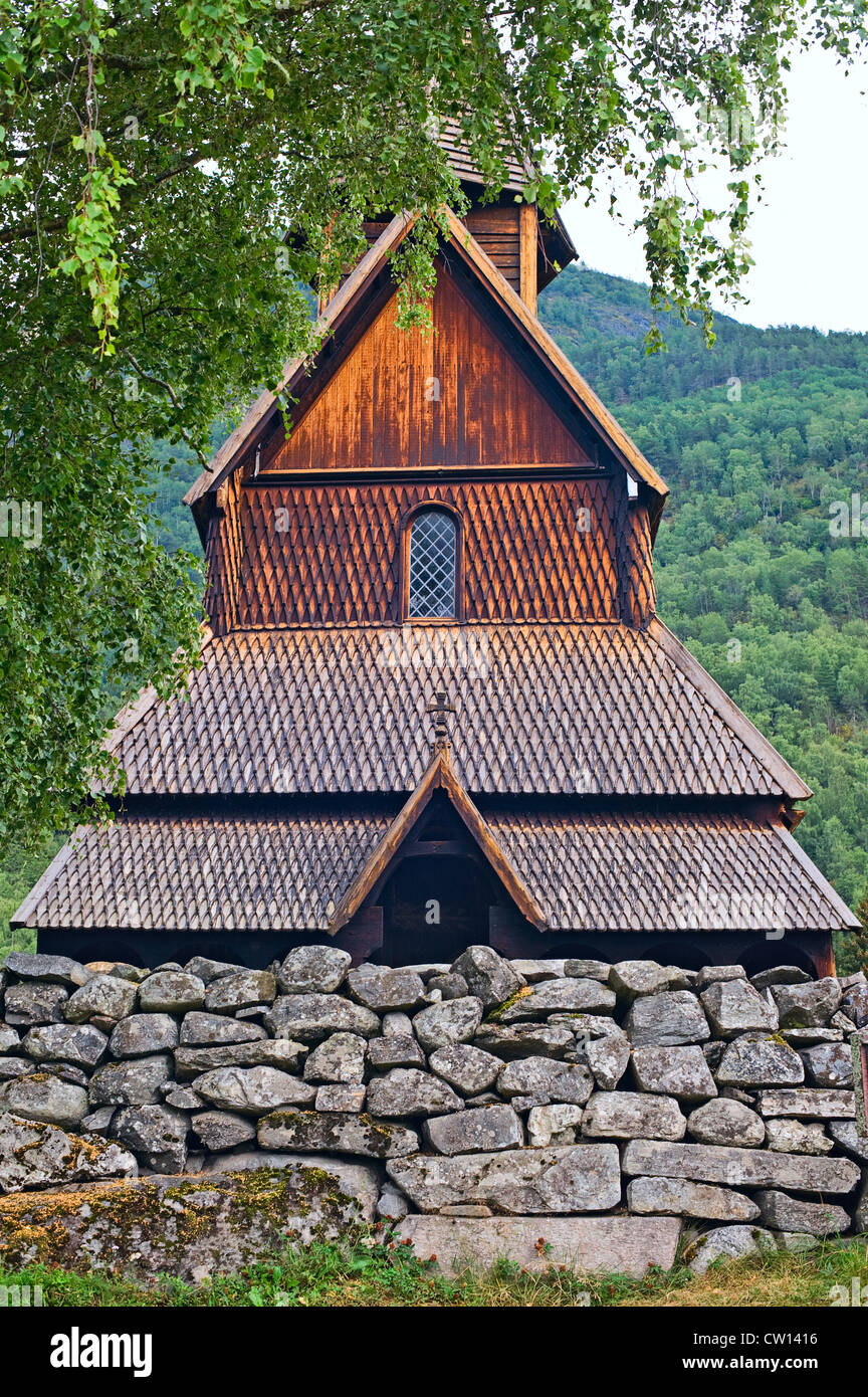 Norwegian ancient wooden church by tree Stock Photo - Alamy