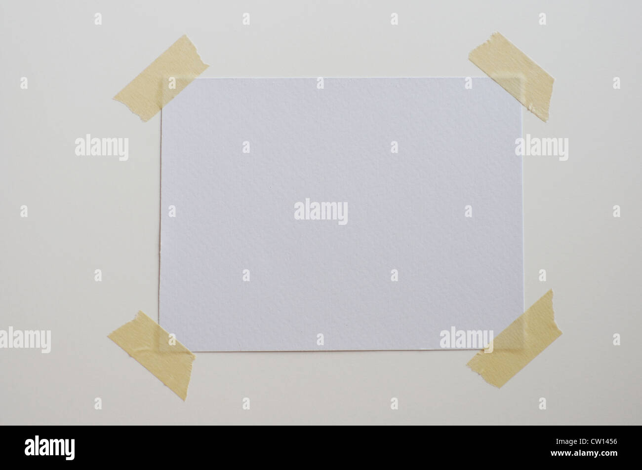 Note paper taped to wall Stock Photo - Alamy