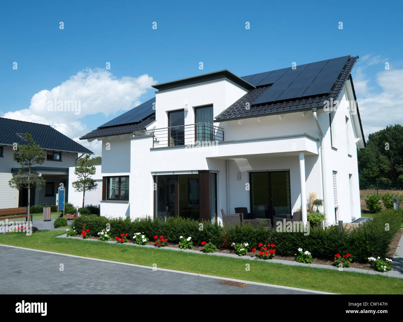 Modern highly energy efficient family house with solar panels on roof ...