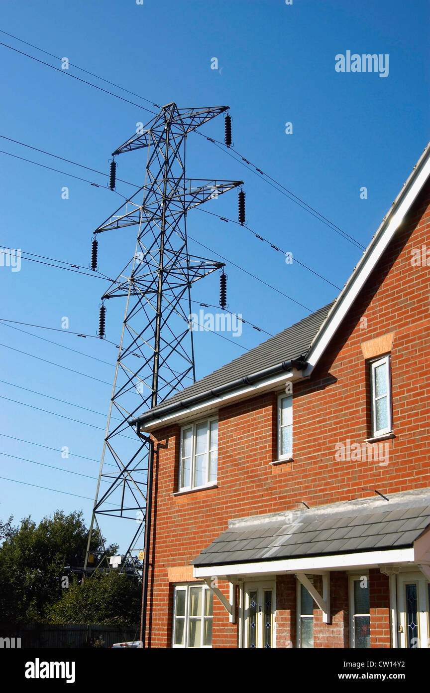Houses with Electric pylon, England Stock Photo - Alamy