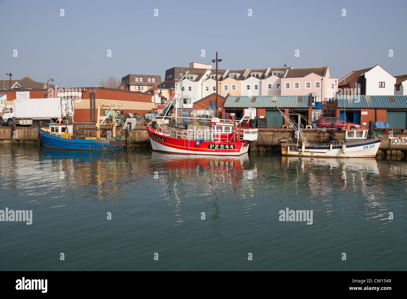City of Portsmouth, England. Picturesque view of fishing boats berthed ...