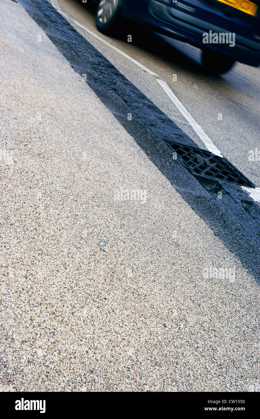 Road marking with feature for blind people at pedestrian crossing. UK ...