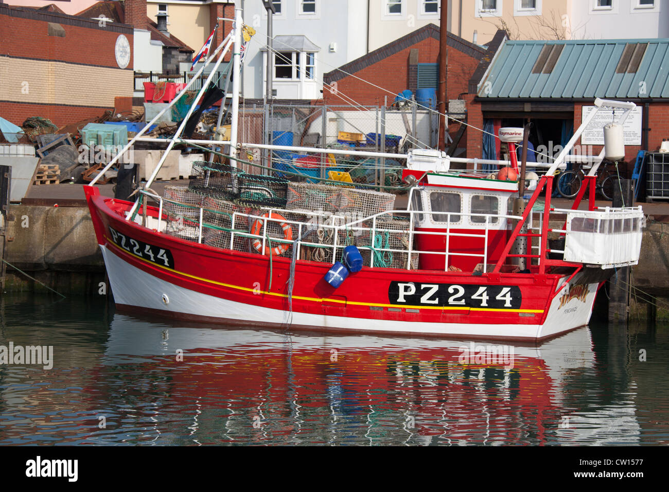City of Portsmouth, England. Picturesque view of a red fishing boat ...