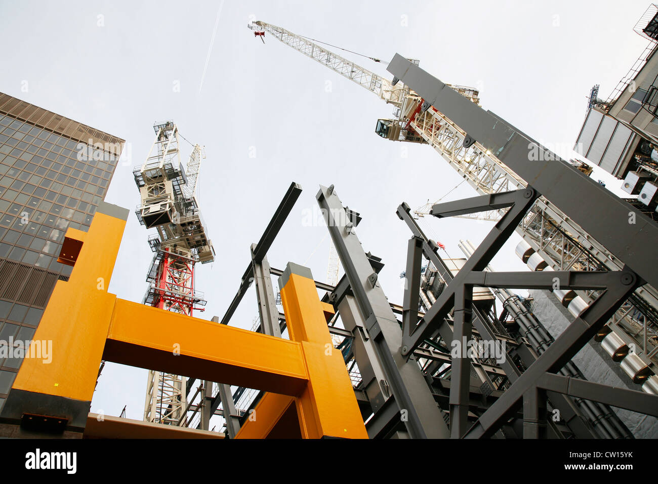 multiple cranes working on huge construction site Stock Photo - Alamy