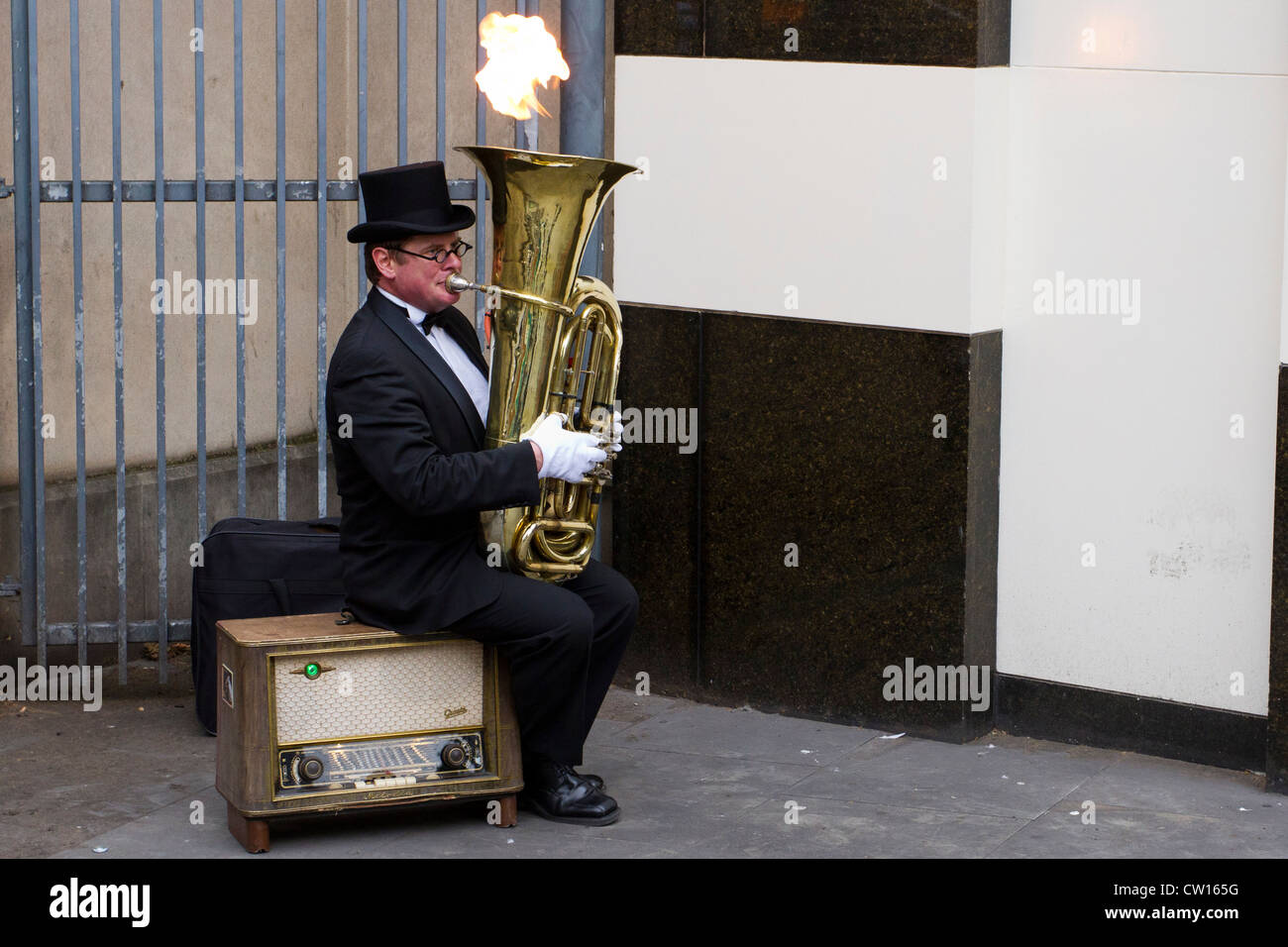 Man busking with a tuba that shoots fire, London, England, UK Stock ...