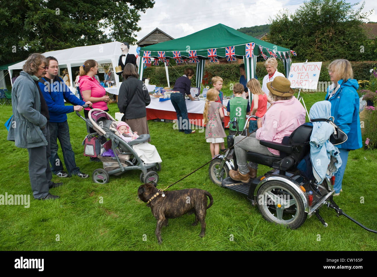 Visitors browse stalls at fete on Scarecrow Day in village of Brampton ...