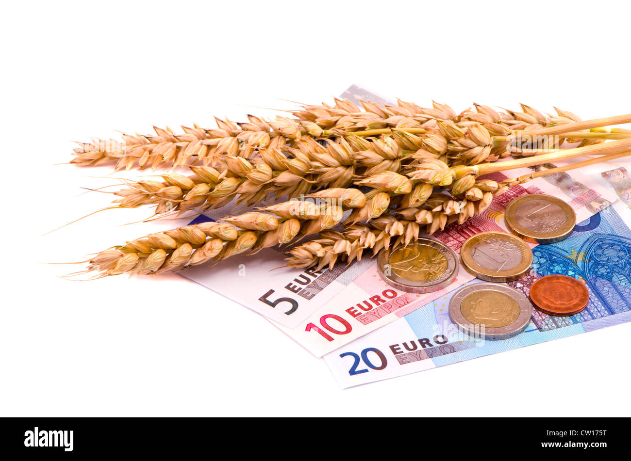 isolated on white wheats harvest ears and euro Stock Photo - Alamy