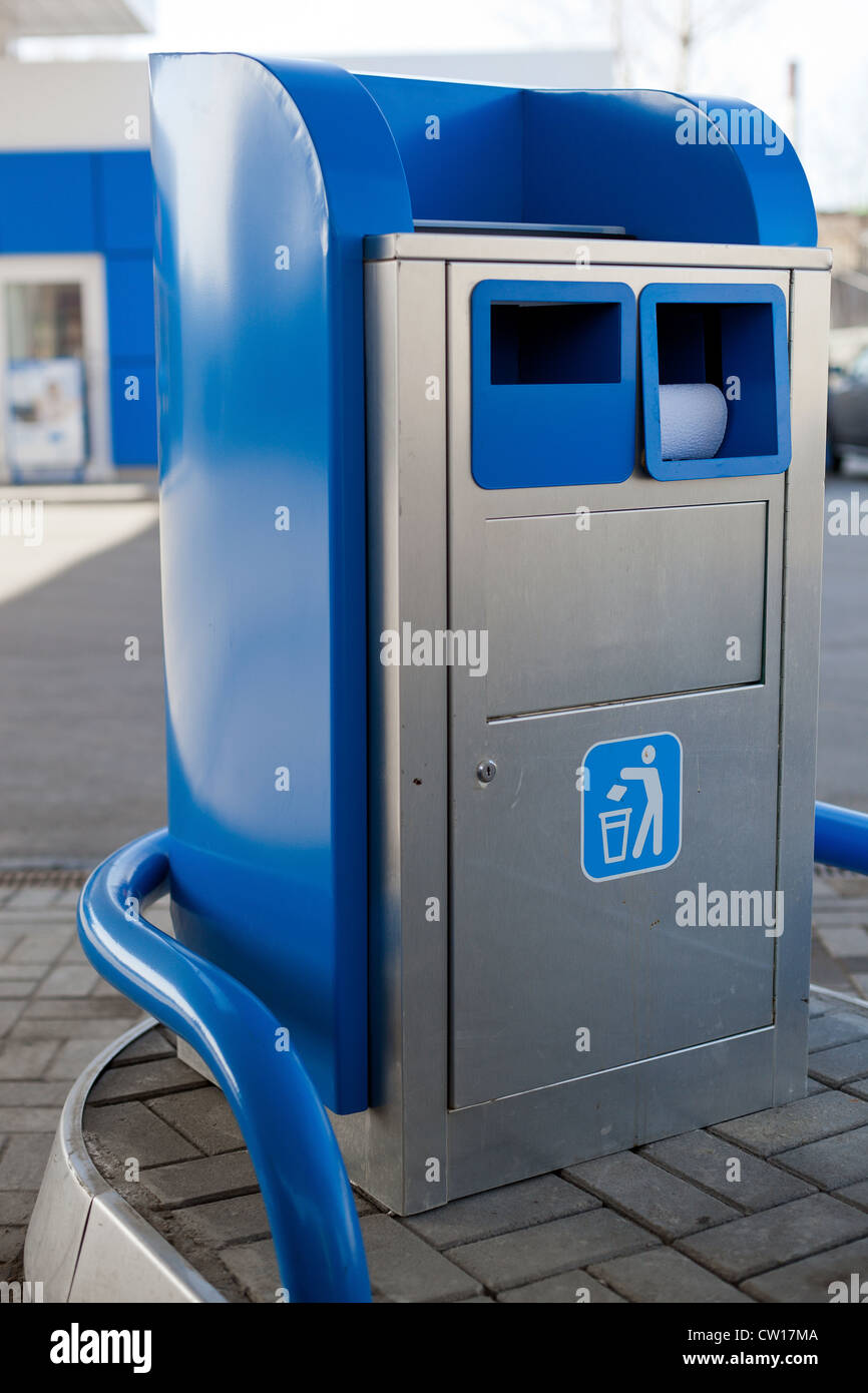 Blue garbage can on gas station Stock Photo - Alamy