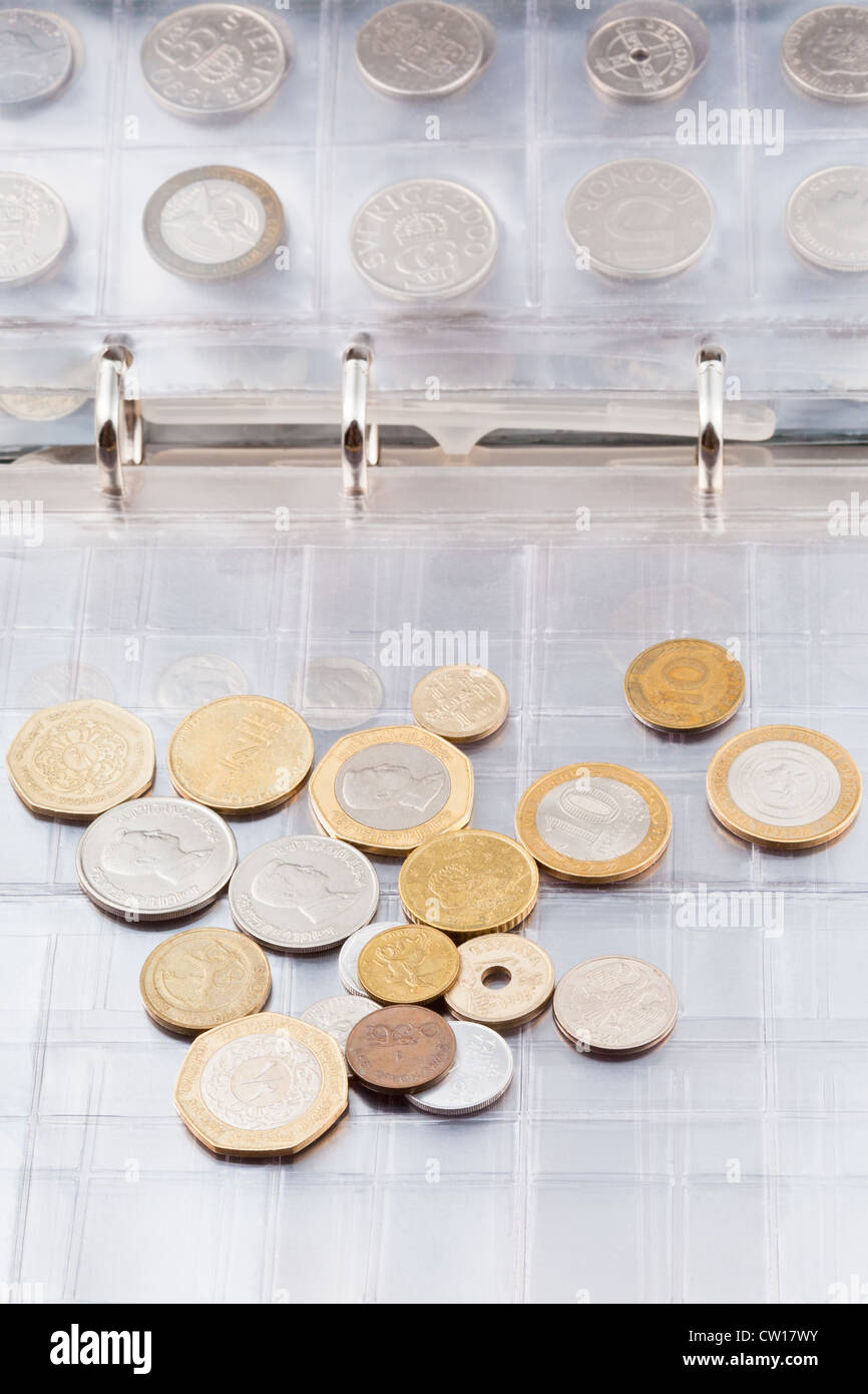 page of numismatics album with different coins Stock Photo - Alamy