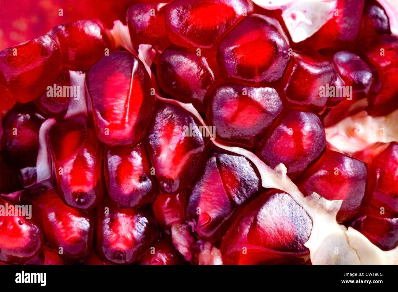 broken pomegranate close up Stock Photo - Alamy