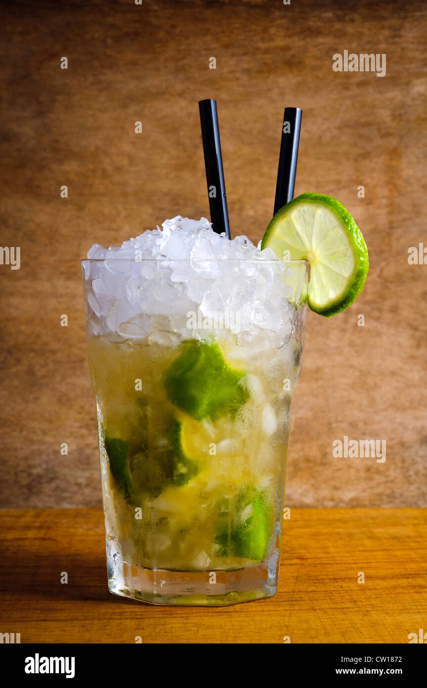 Caipirinha cocktail on a vintage wooden background Stock Photo - Alamy