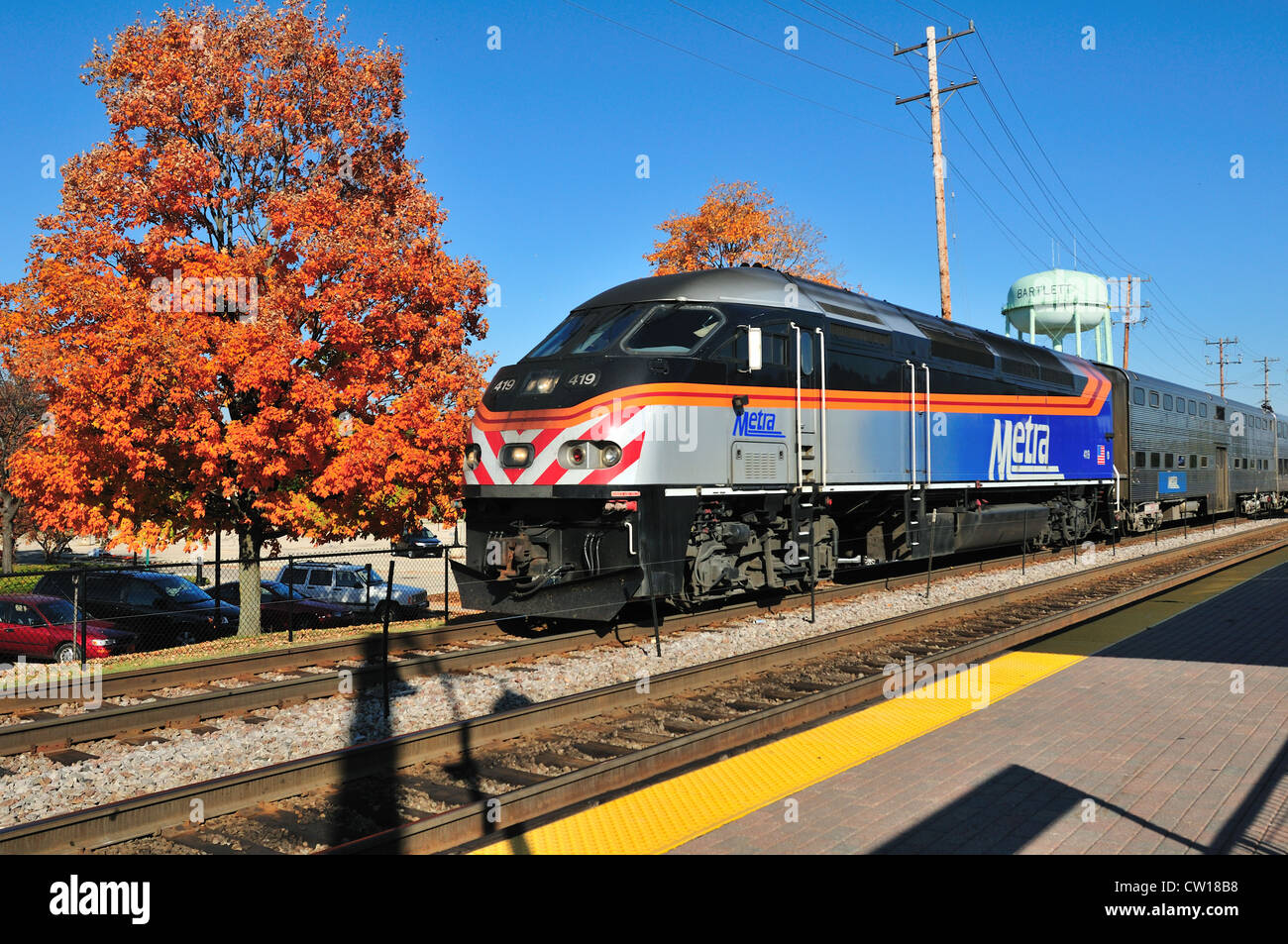 USA Illinois Metra commuter train arriving at the Bartlett suburban ...