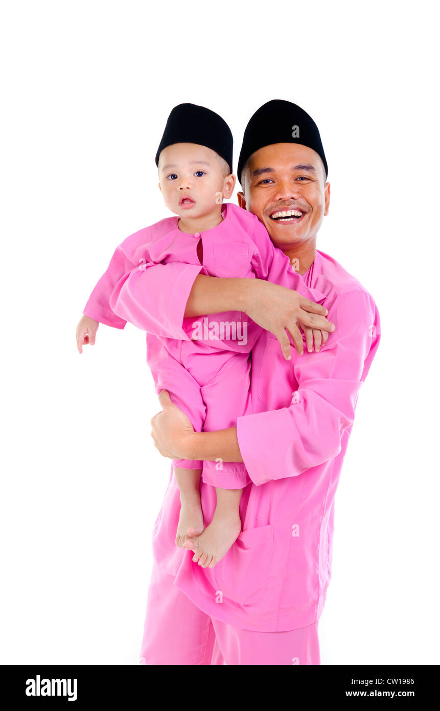 malay father and son during hari raya Stock Photo - Alamy