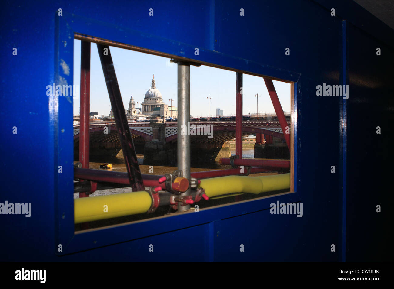 a view of St Paul's Cathedral and scaffolding - seen through a window ...