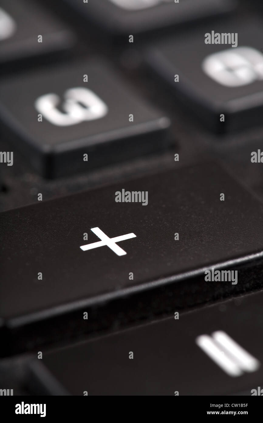 sum button on black calculator close-up Stock Photo - Alamy