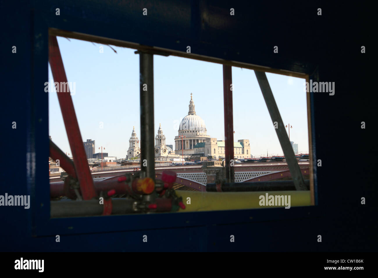 a view of St Paul's Cathedral and scaffolding - seen through a window ...