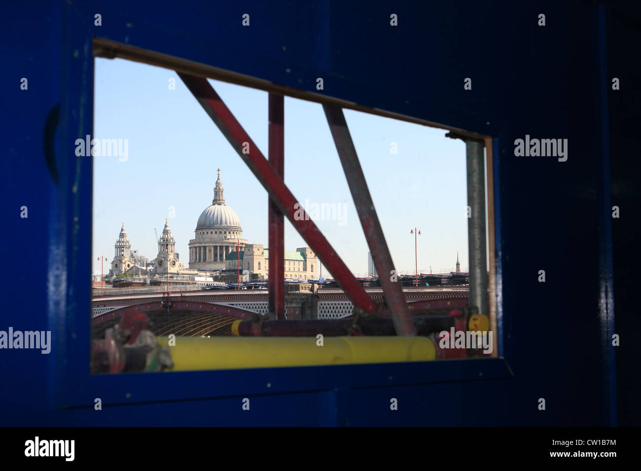 a view of St Paul's Cathedral and scaffolding - seen through a window ...