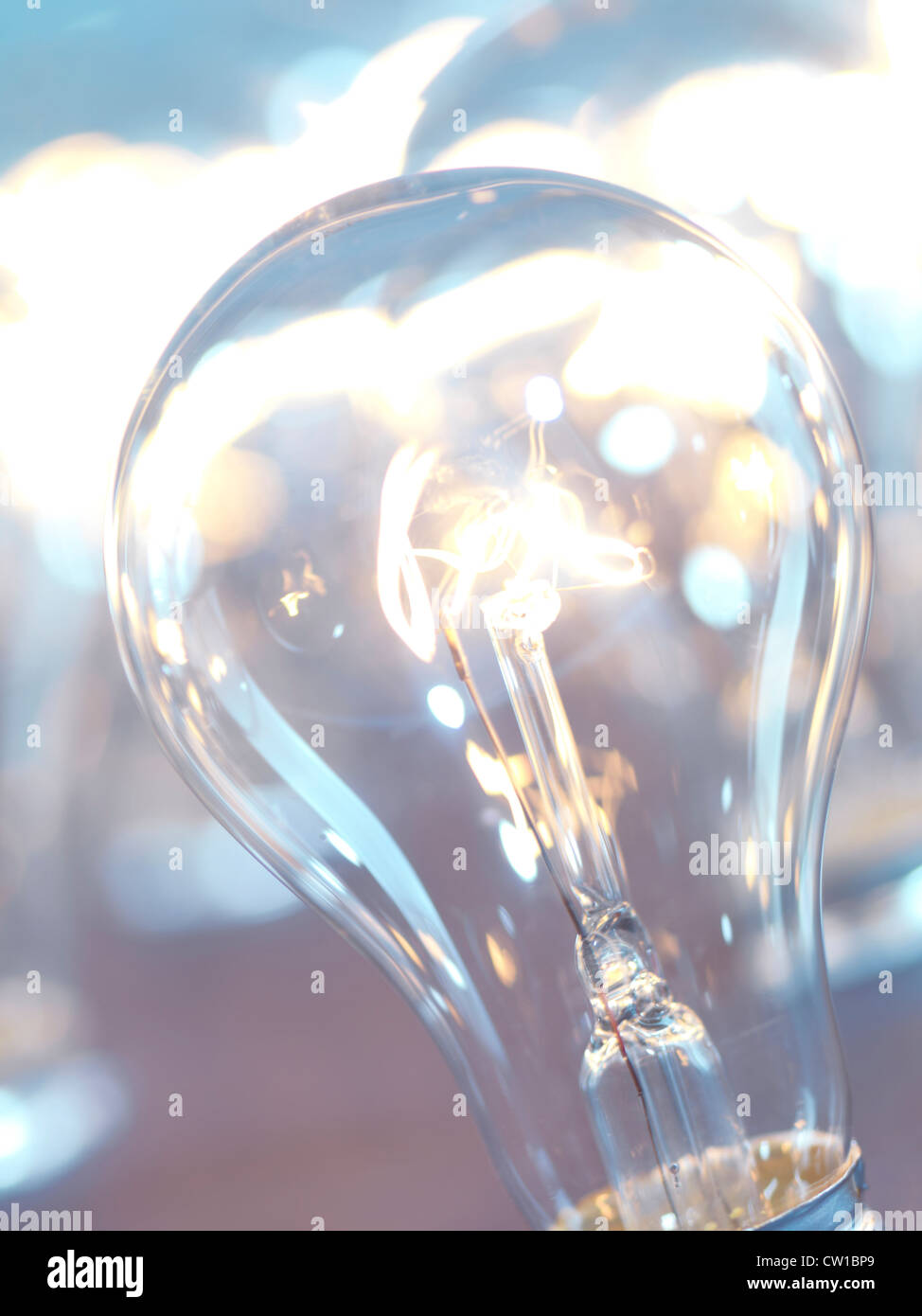 Illuminated incandescent light bulb closeup abstract background Stock ...