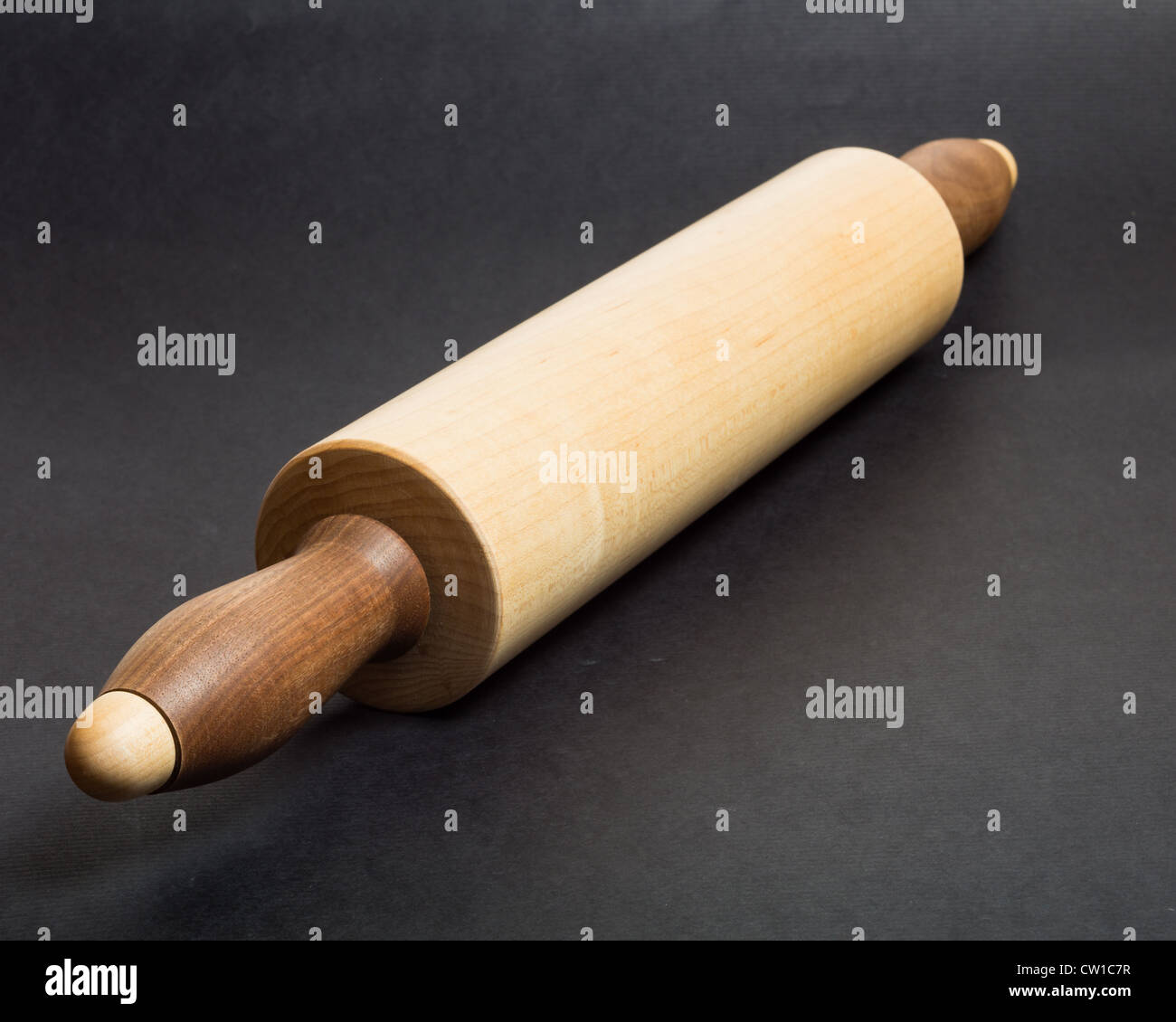 Wooden maple rolling pin on black bakery table Stock Photo - Alamy