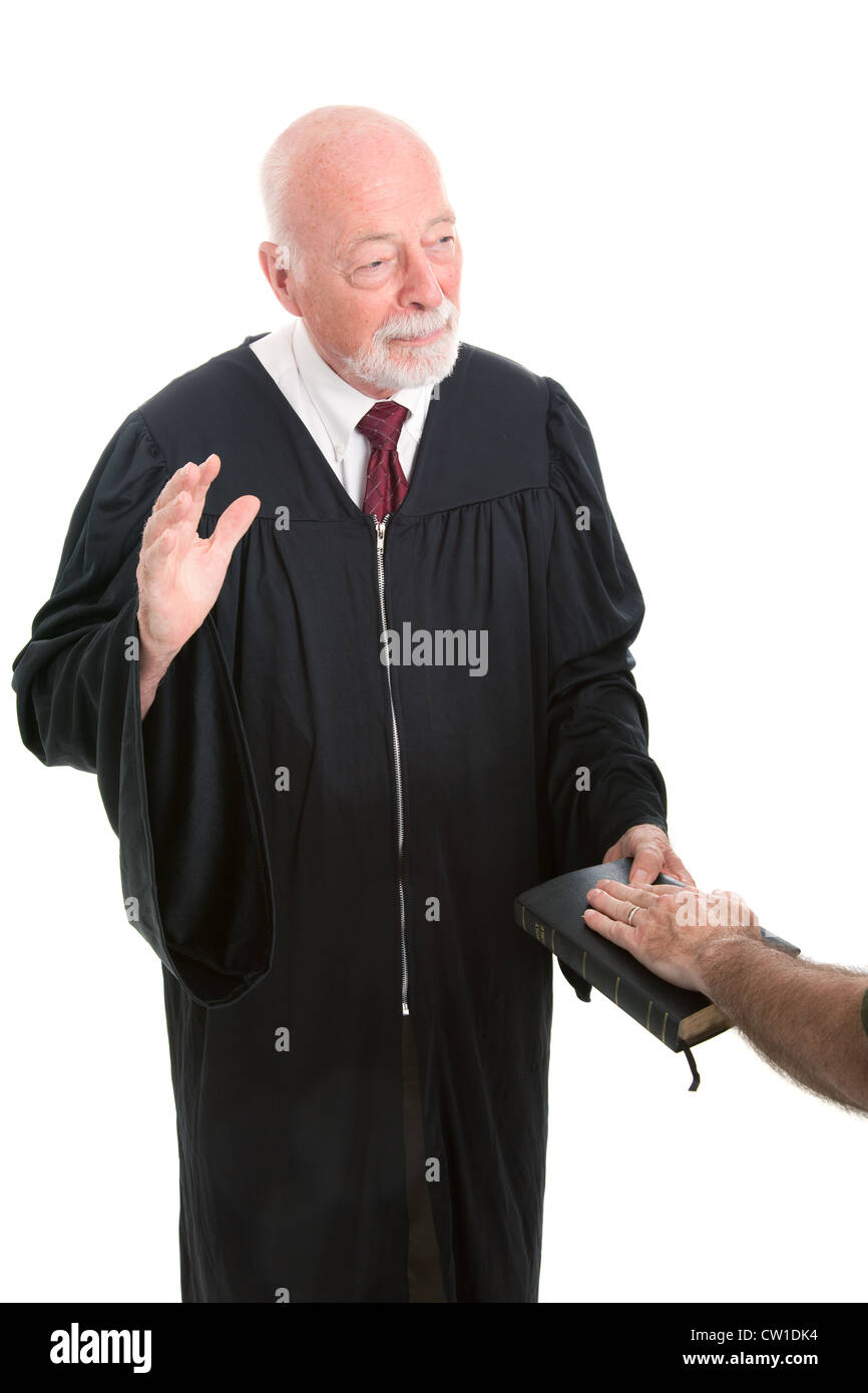 Judge swearing in a witness on the Holy Bible. Isolated on white Stock ...