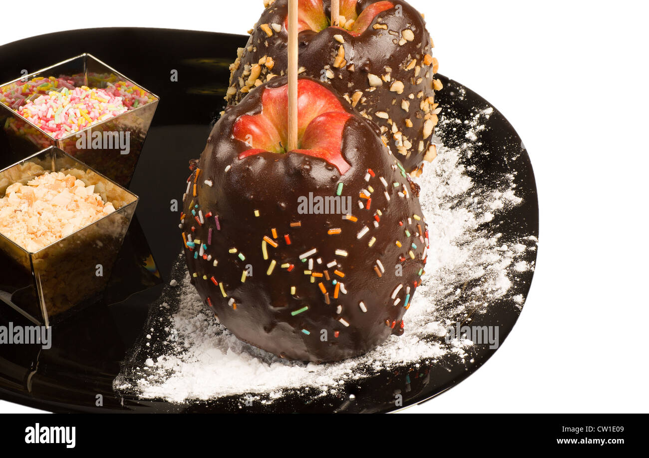 Portion of sweet apples in a chocolate coating Stock Photo - Alamy