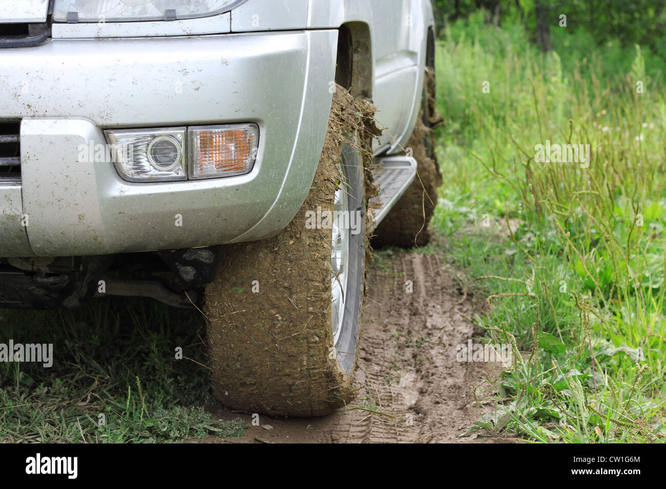Extreme offroad behind an unrecognizable car in mud Stock Photo - Alamy