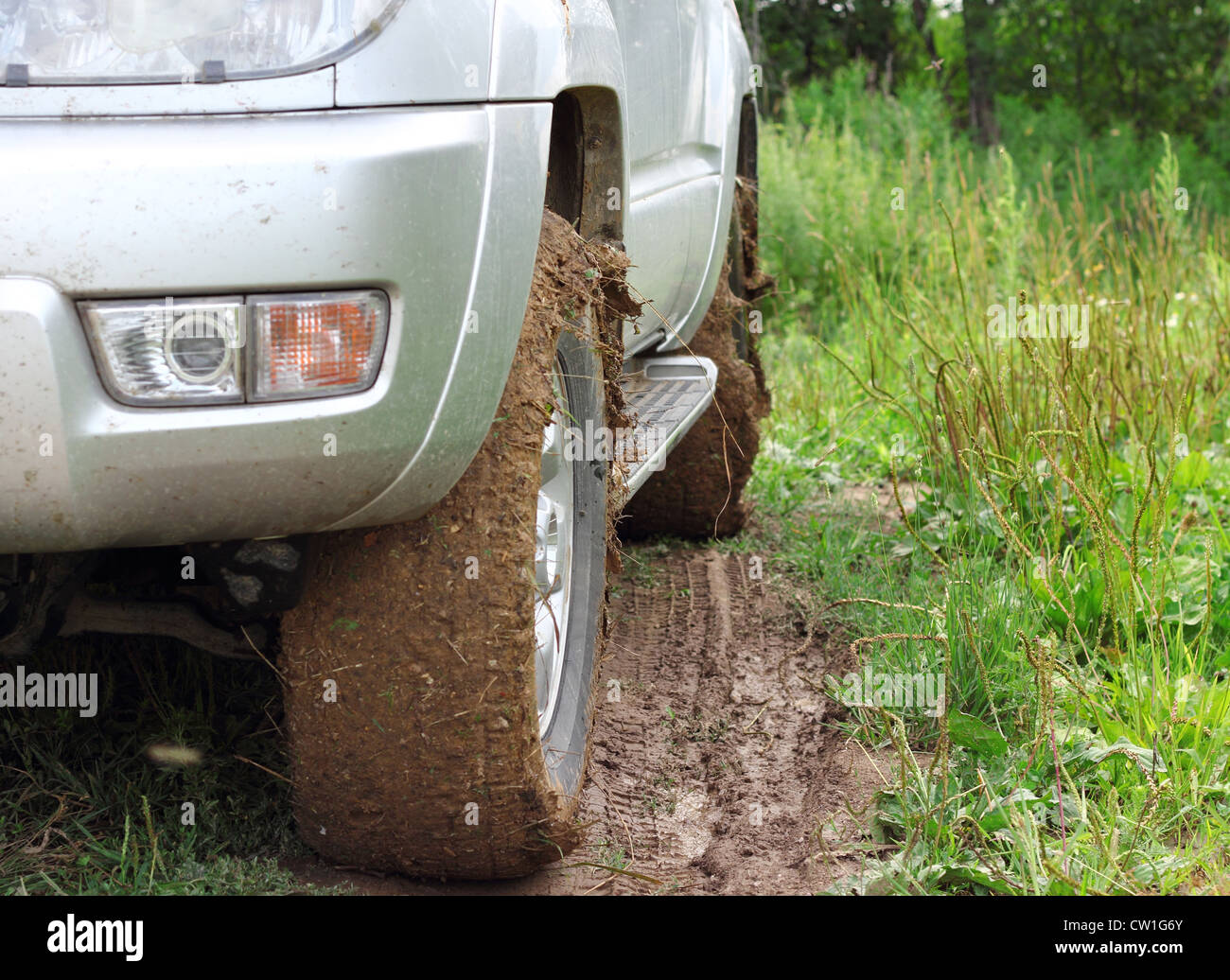 Extreme offroad behind an unrecognizable car in mud Stock Photo - Alamy