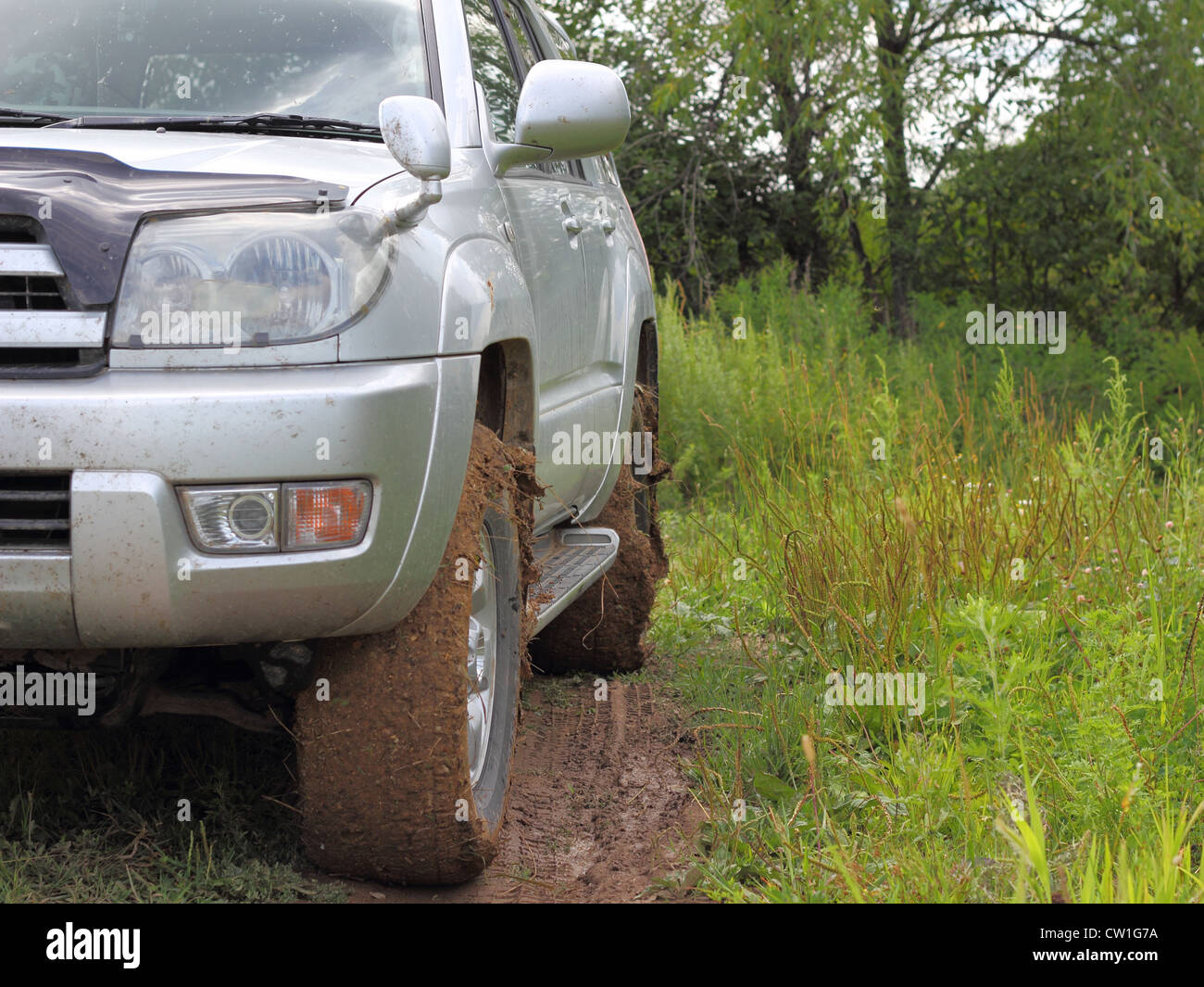 Extreme offroad behind an unrecognizable car in mud Stock Photo - Alamy