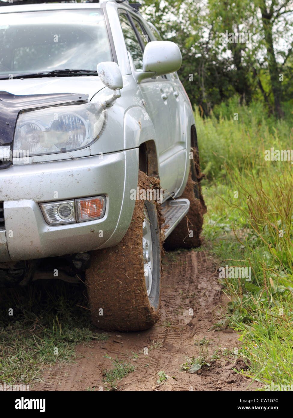 Extreme offroad behind an unrecognizable car in mud Stock Photo - Alamy