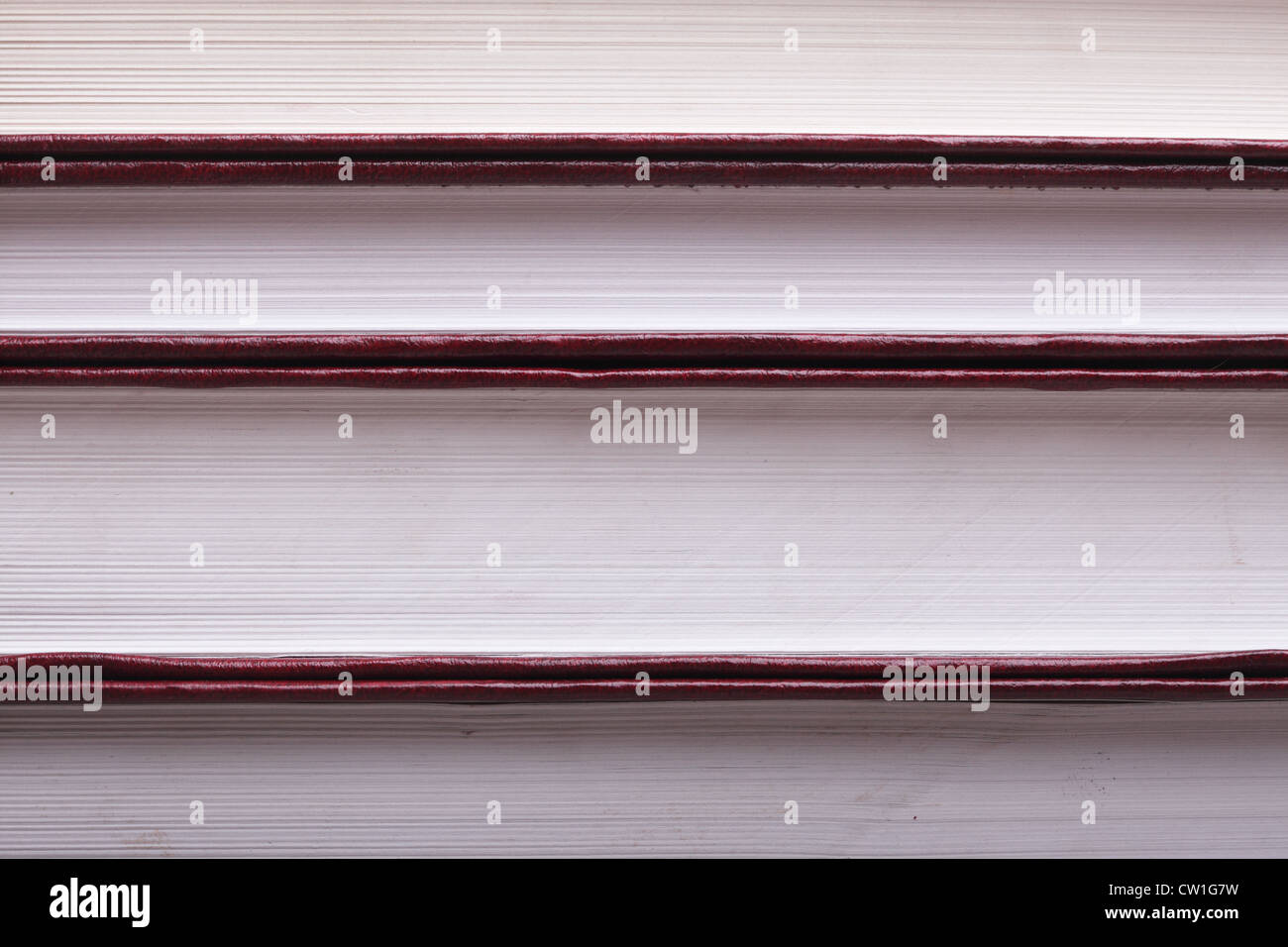 Isolated on white stack red book library object Stock Photo - Alamy