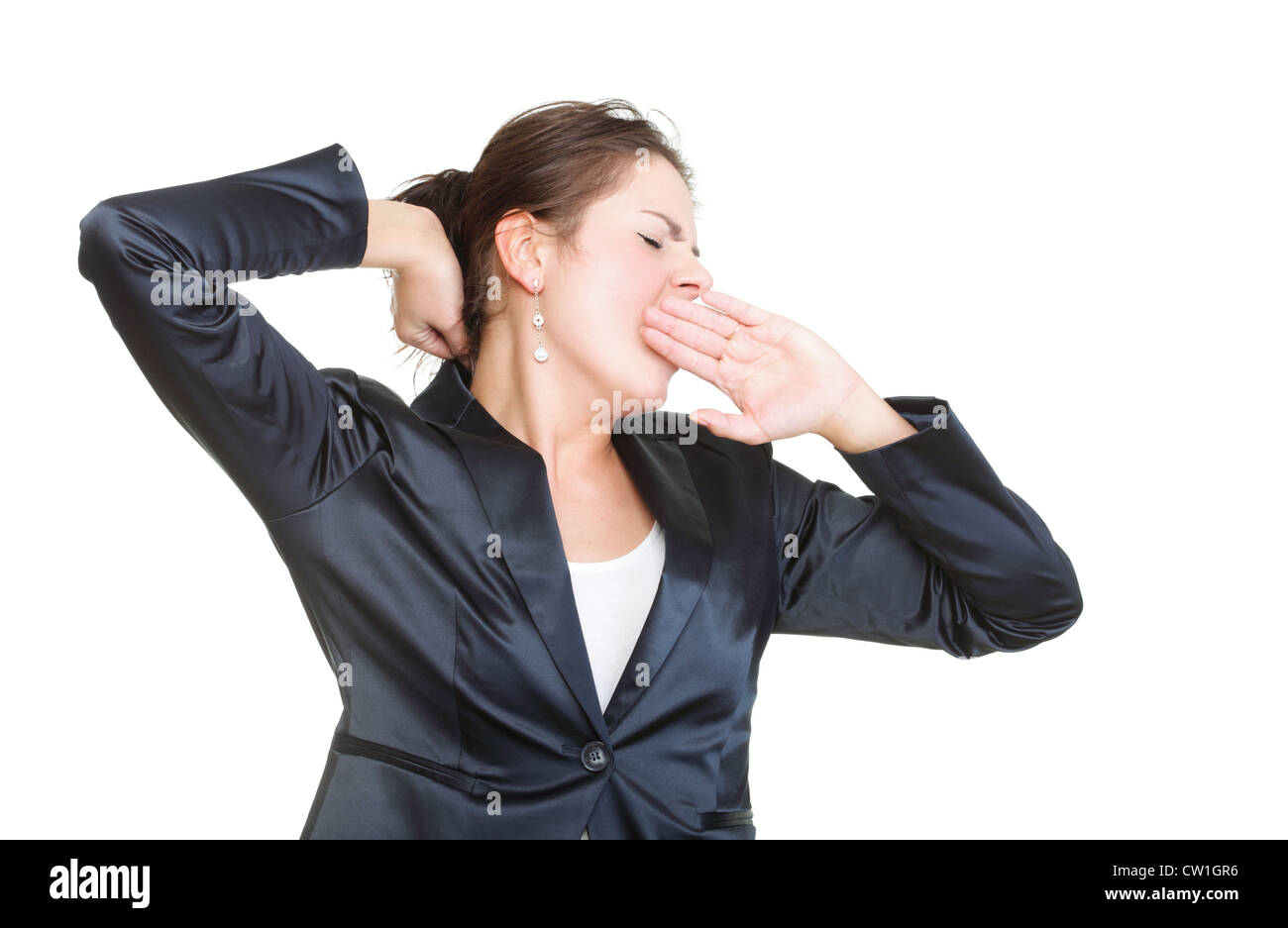 portrait of beautiful tired business woman stretching and yawning at ...