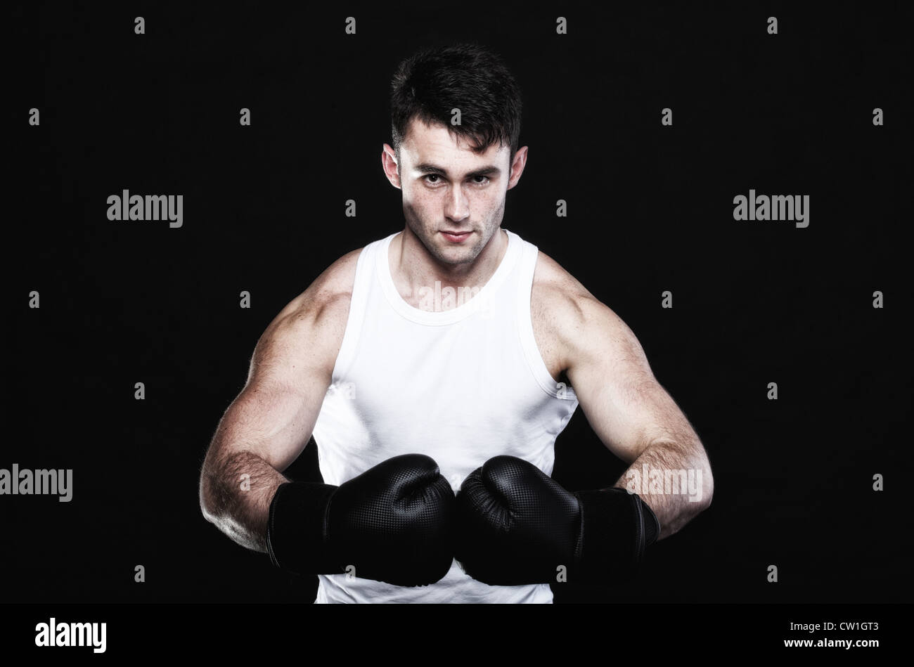 Portrait sportsman boxer in studio against dark background Stock Photo ...