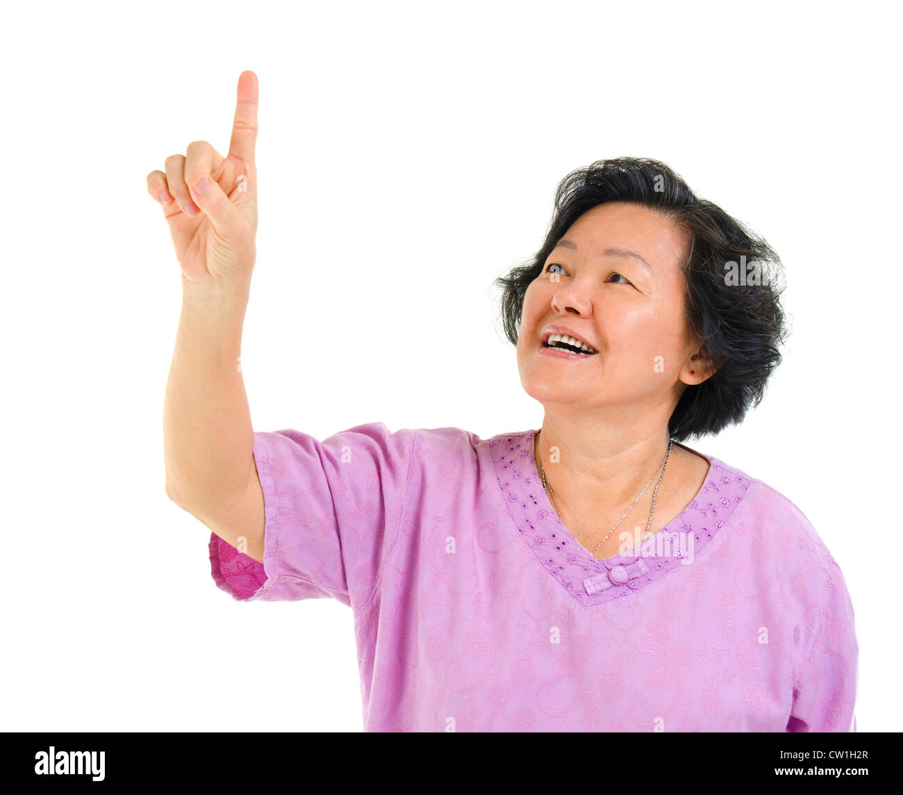 60s Asian senior woman pointing on transparent virtual screen button ...