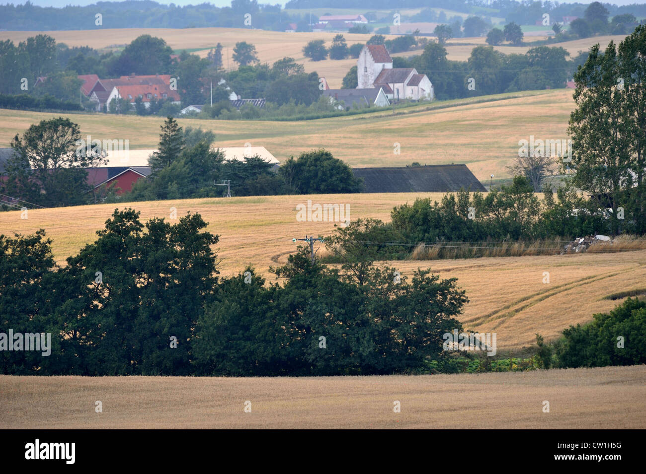 Hilly farming landscape with farms and an old church Stock Photo - Alamy